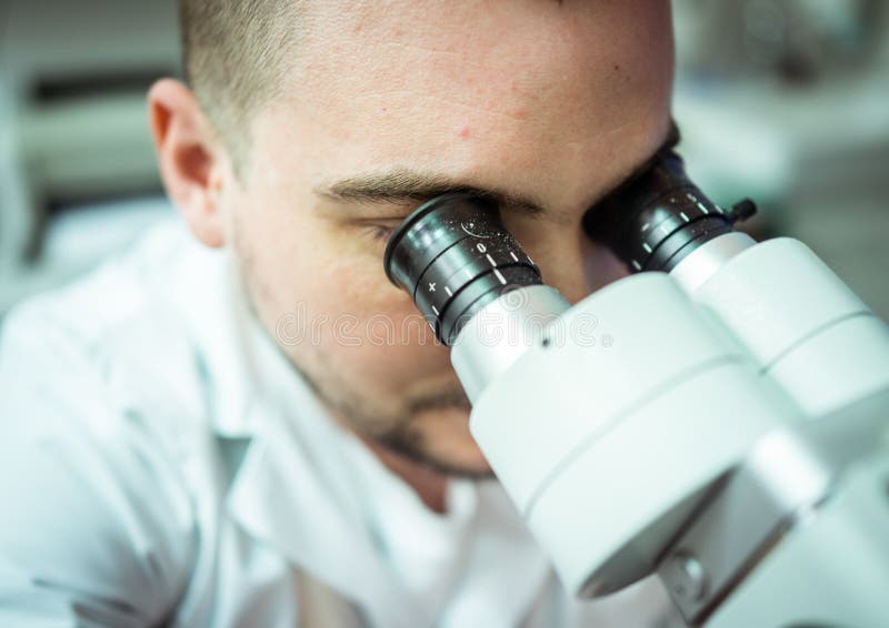 Doctor Scientist Using Microscope in Hospital Lab Stock Photo - Image ...