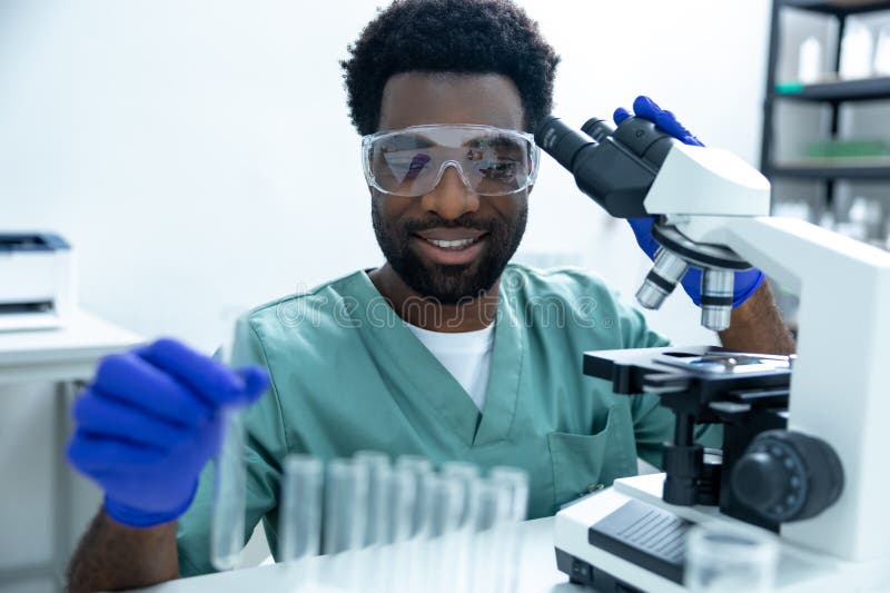 Doctor Scientist Working in Laboratory Using Technology and Microscope ...