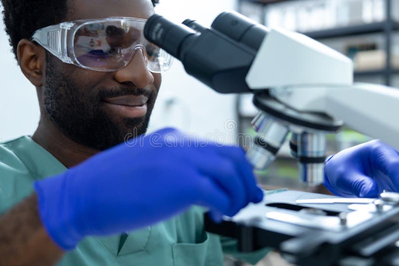 Doctor Scientist Working in Laboratory Using Technology and Microscope ...