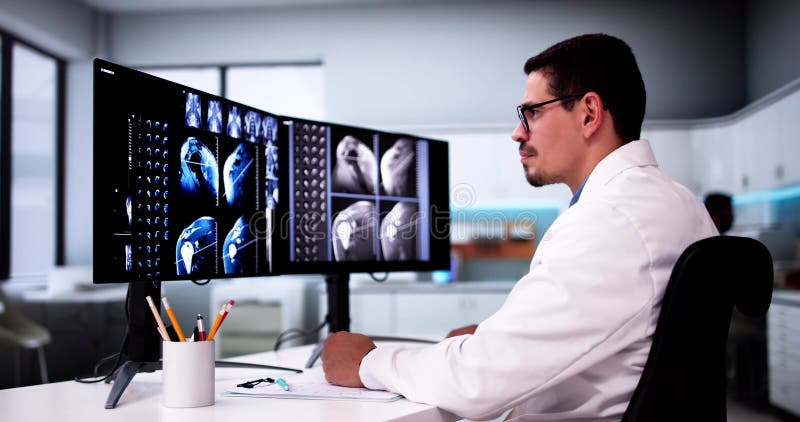 Midsection of Doctor Using Laptop and Mouse at Desk Stock Image - Image ...