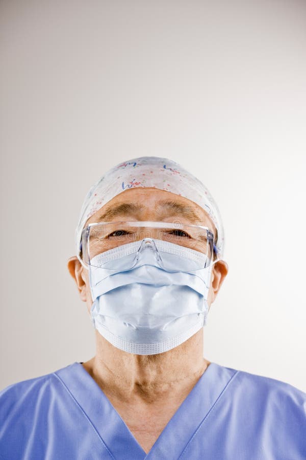 Doctor in Scrubs, Surgical Mask, Surgical Cap Stock Photo - Image of ...