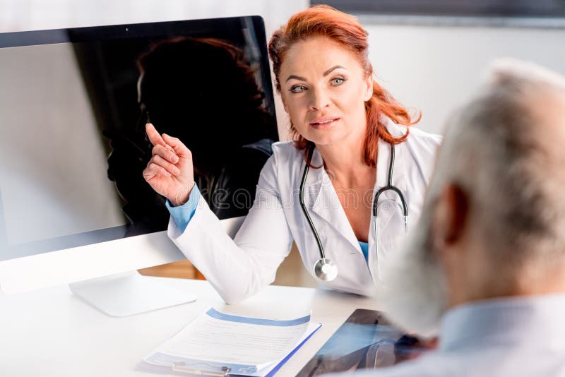 Doctor and senior patient stock photo. Image of bearded - 90496442