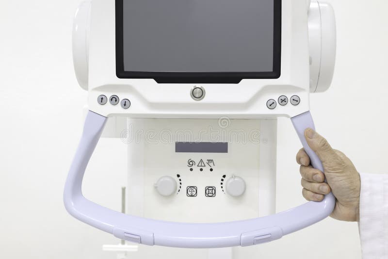 A Doctor Setting Up a X-ray Machine Stock Photo - Image of expertise ...