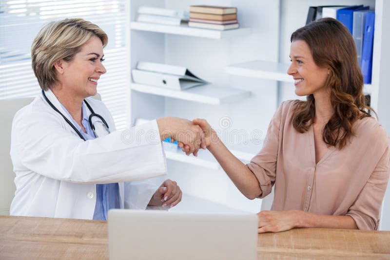 Doctor Shaking Hands with Patient Stock Photo - Image of care, clinic ...