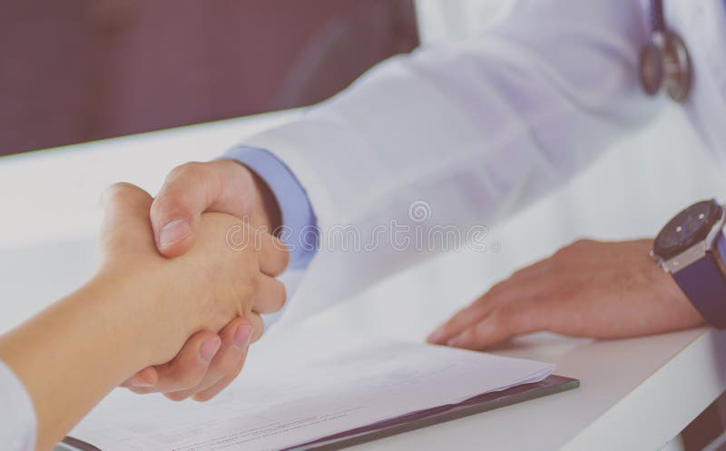Doctor Shaking Hands To Patient in the Office at Desk Stock Photo ...