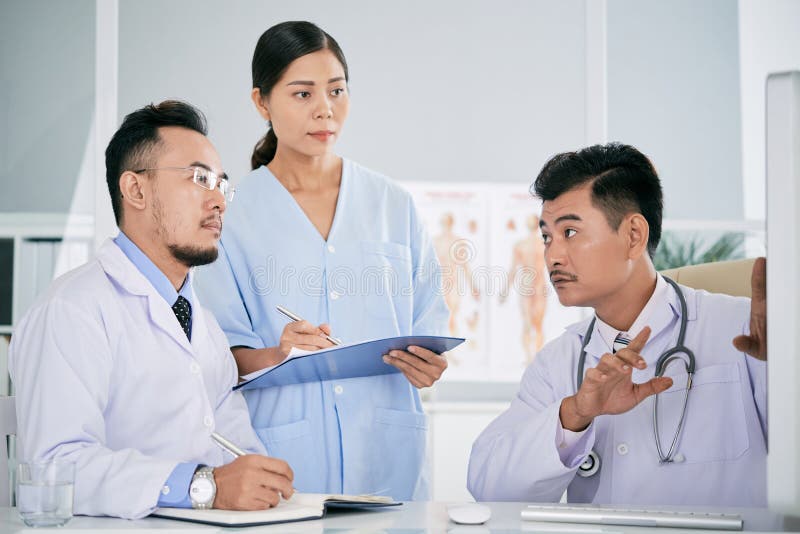Doctors Learning Something New Stock Image - Image of people, intern ...