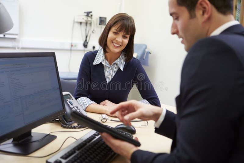 Doctor Showing Patient Test Results on Digital Tablet Stock Photo ...