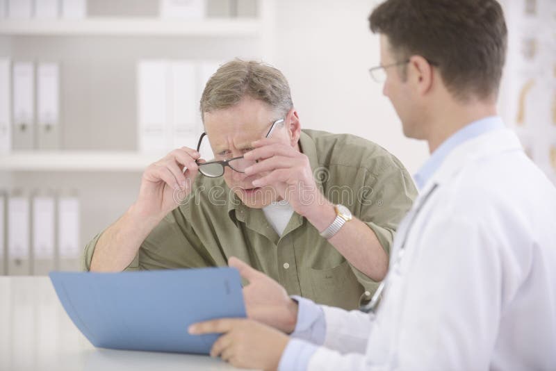Doctor Showing Results To Myopic Patient Stock Image - Image of ...