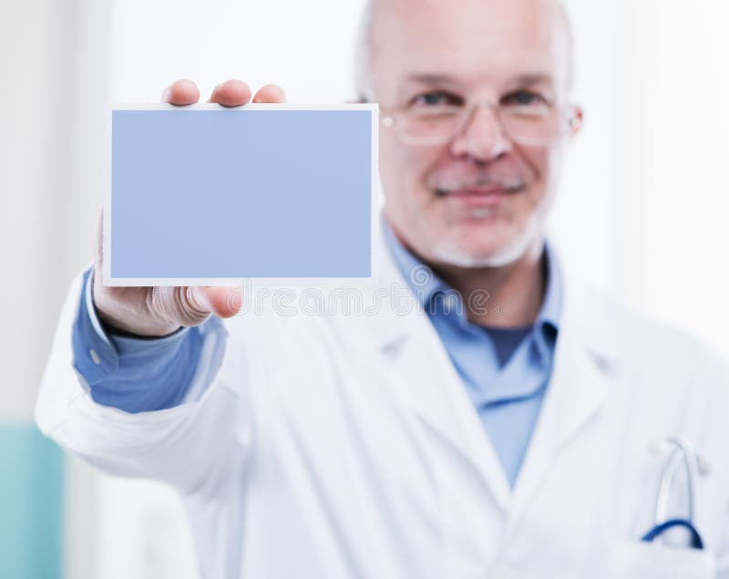 Doctor with sign stock image. Image of pointing, holding - 44561619