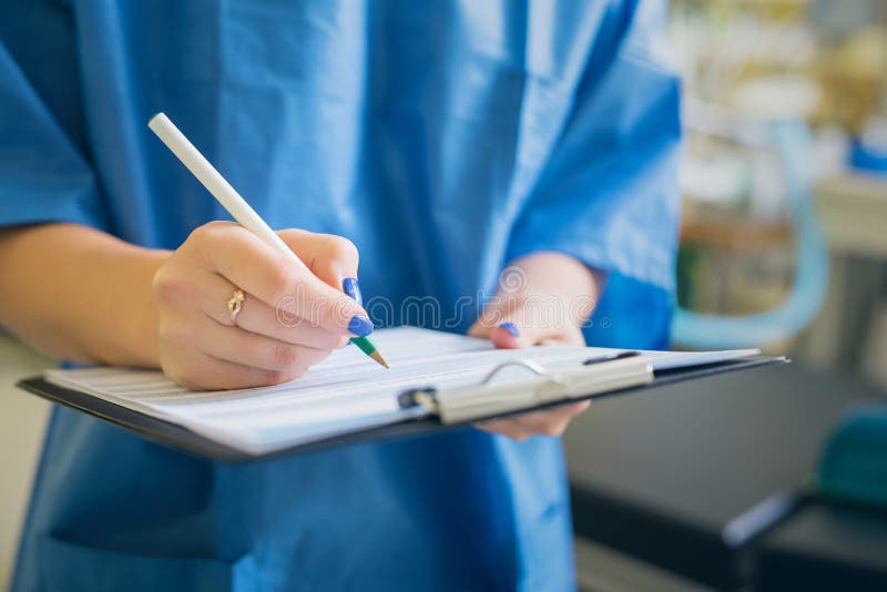 Doctor signing papers stock image. Image of white, equipment - 83872933