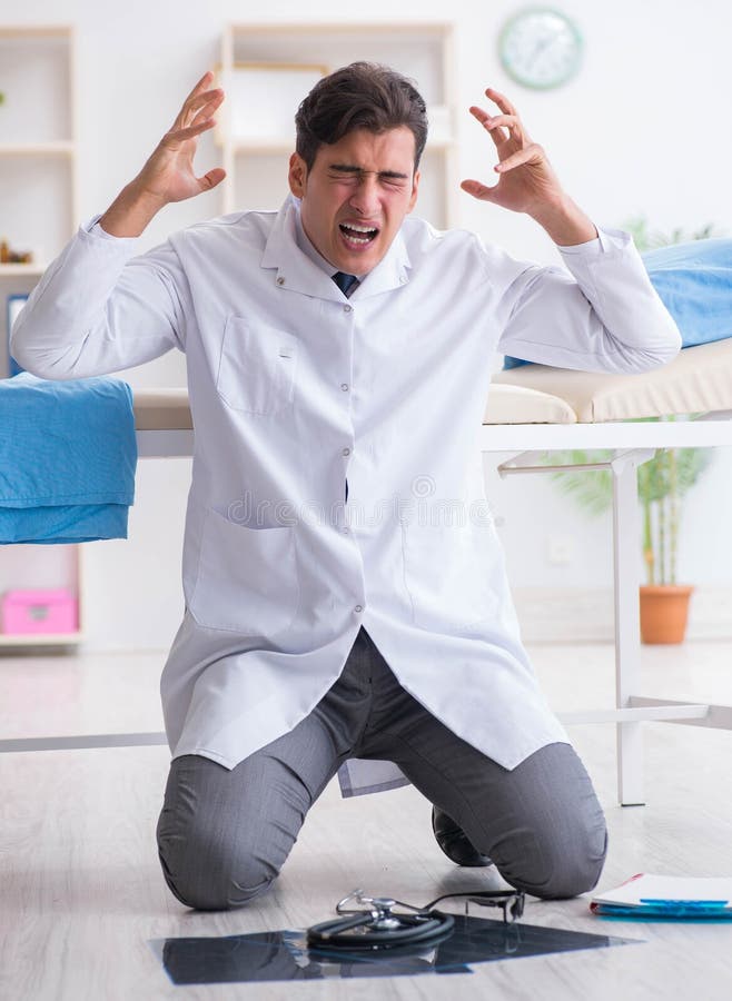 Doctor Sitting on the Floor in Hospital Stock Image - Image of couch ...