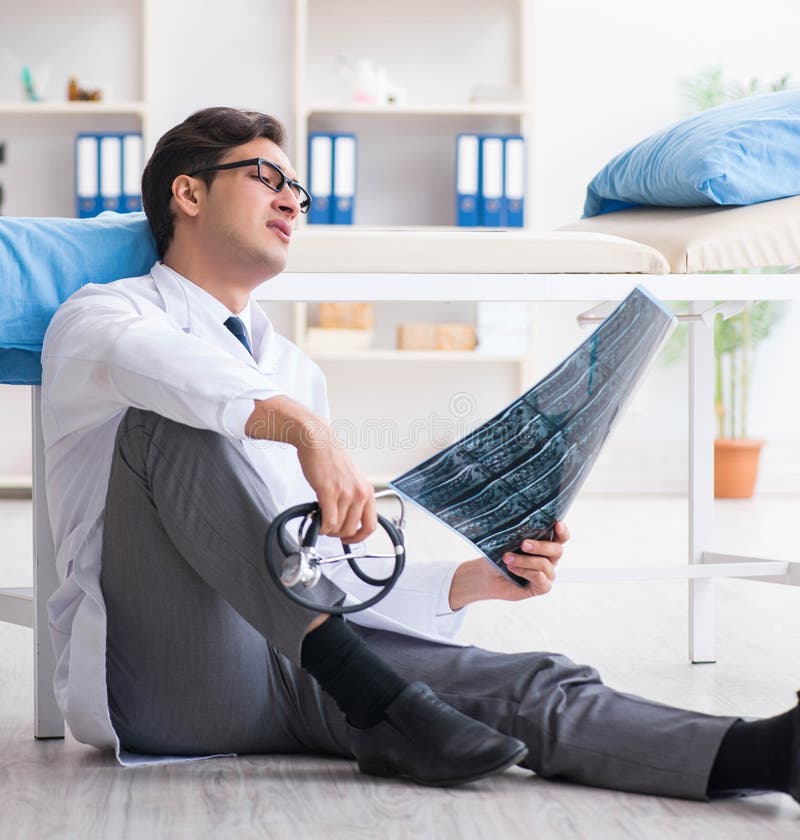 Doctor Sitting on the Floor in Hospital Stock Photo - Image of ...