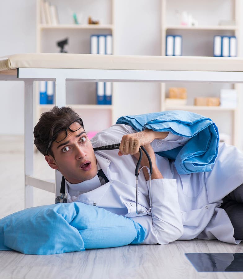 The Doctor Sleeping on Floor after Long Night Shift Stock Photo - Image ...