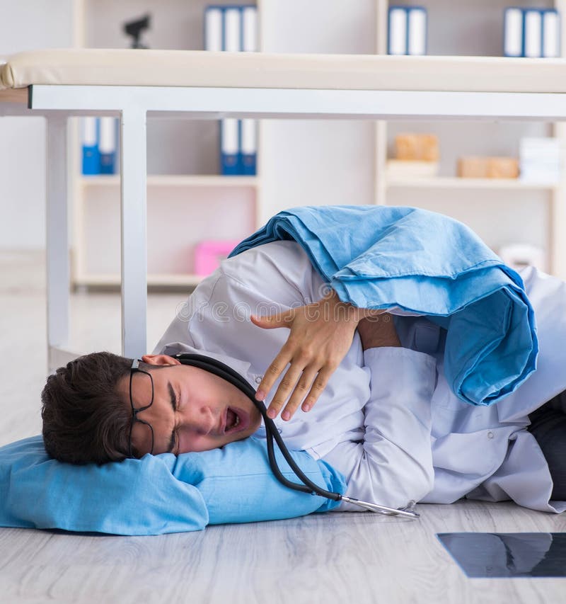 Doctor Sleeping on Floor after Long Night Shift Stock Photo - Image of ...