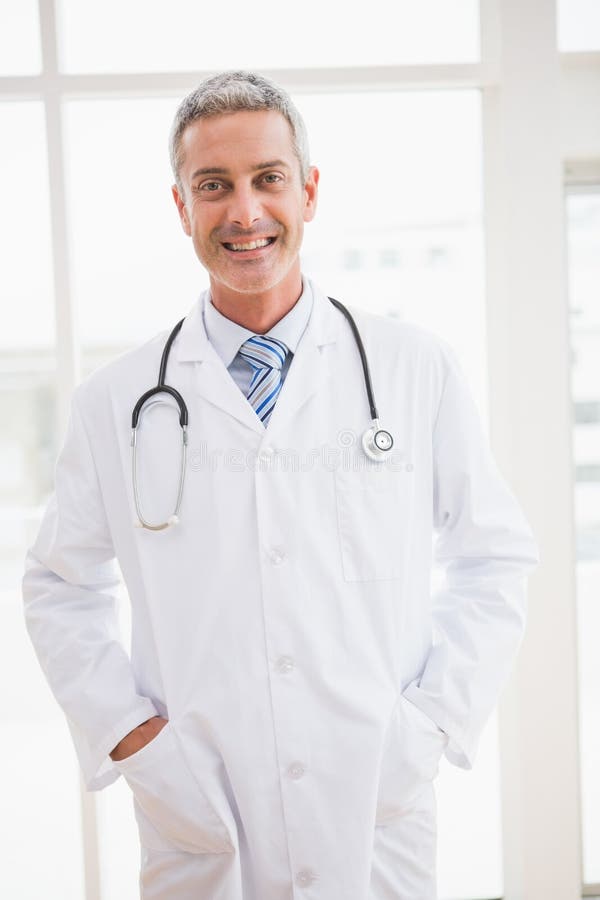 Doctor smiling at camera stock image. Image of service - 49886053