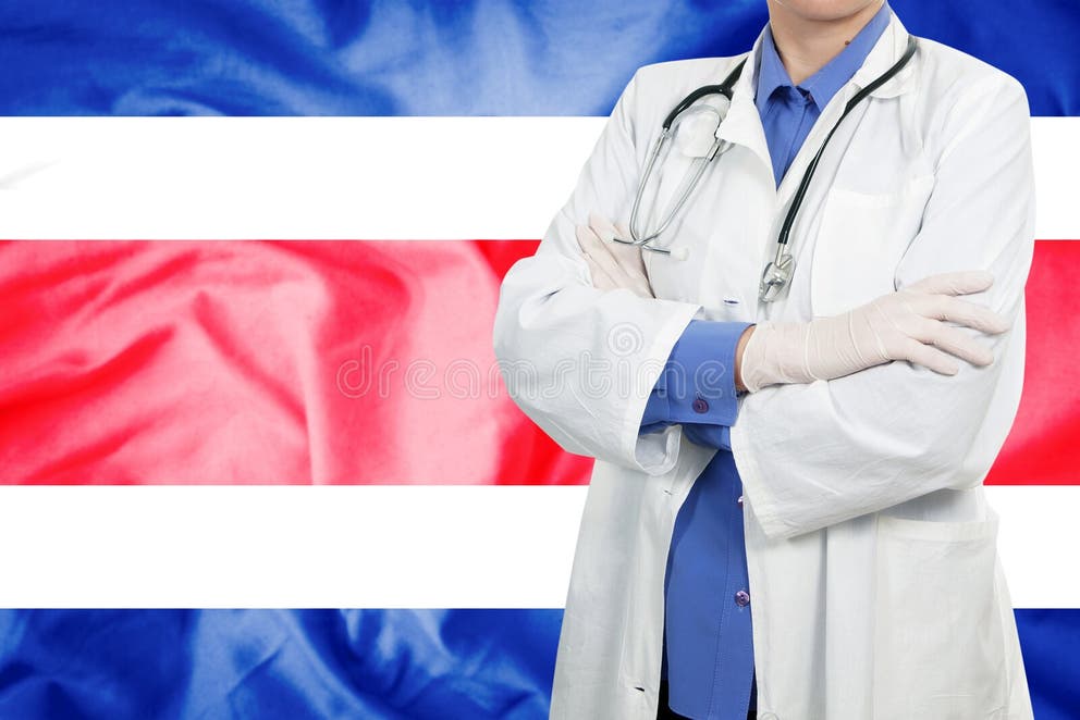 Doctor standing with flag stock image. Image of country - 230852801