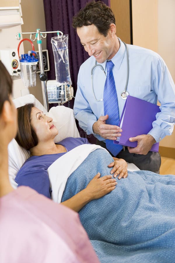 Doctor Standing in Hospital Room with His Patient Stock Image - Image ...
