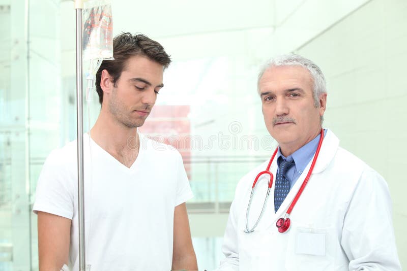 Doctor Standing with a Patient Stock Photo - Image of closeup ...