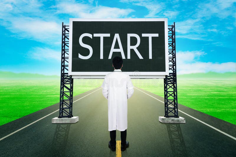 Doctor Standing on Road and Looking with Large Sign of Start Stock ...