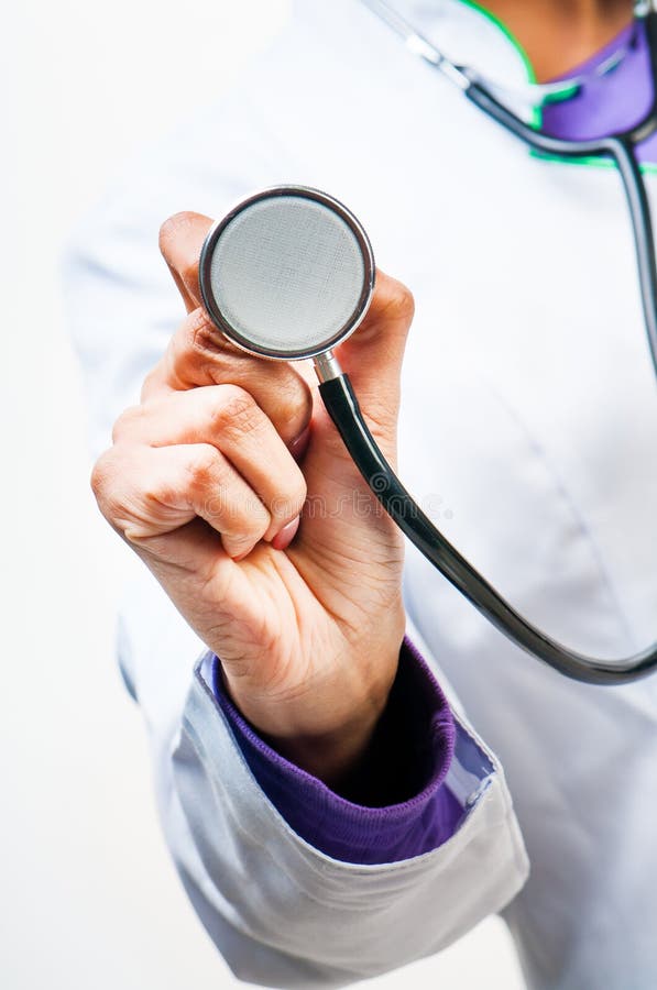Doctor with Stethoscope in Hand on Hospital Background Stock Photo ...