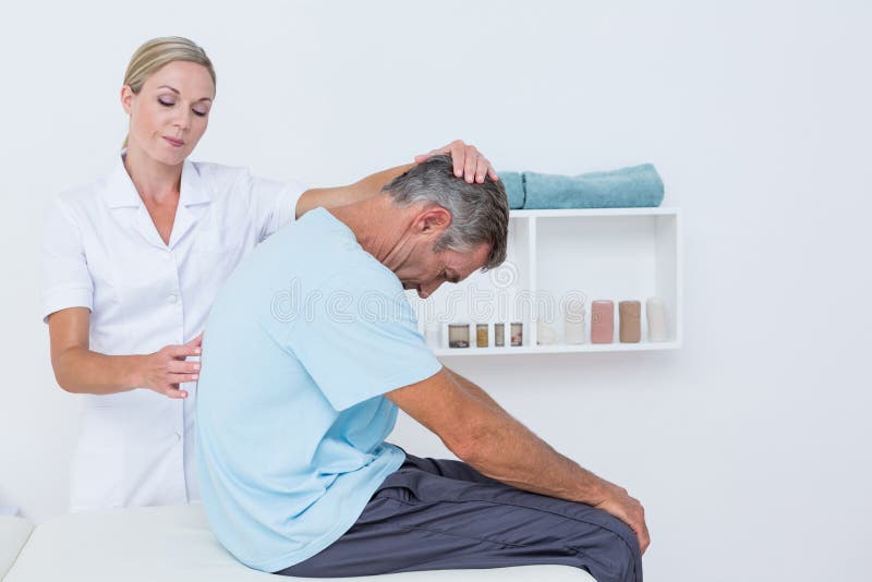 Doctor Stretching A Young Man Arm Stock Image - Image of doctor ...