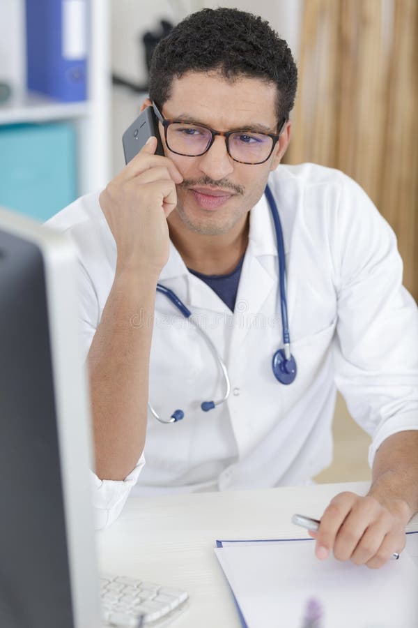 Doctor student on phone stock image. Image of healthcare - 245447481