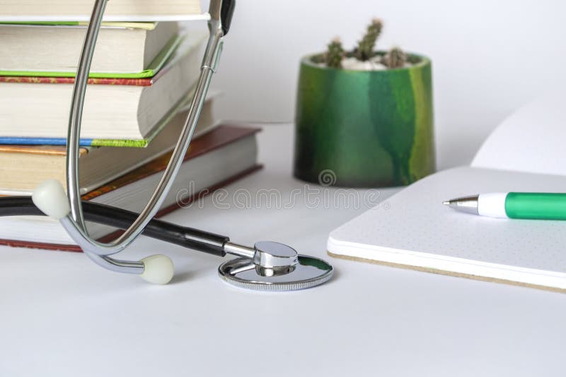Doctor or Student Table with Stethoscope, Notepad, Books. Medical ...