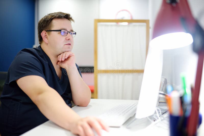 Doctor Studies Patient Medical History or Results of Examination Using ...