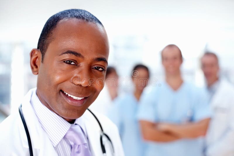 Doctor Supported by Medical Team. Focus on Confident Doctor with Team ...