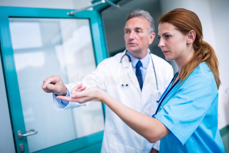 Doctor and Surgeon Discussing with Each Other Stock Image - Image of ...