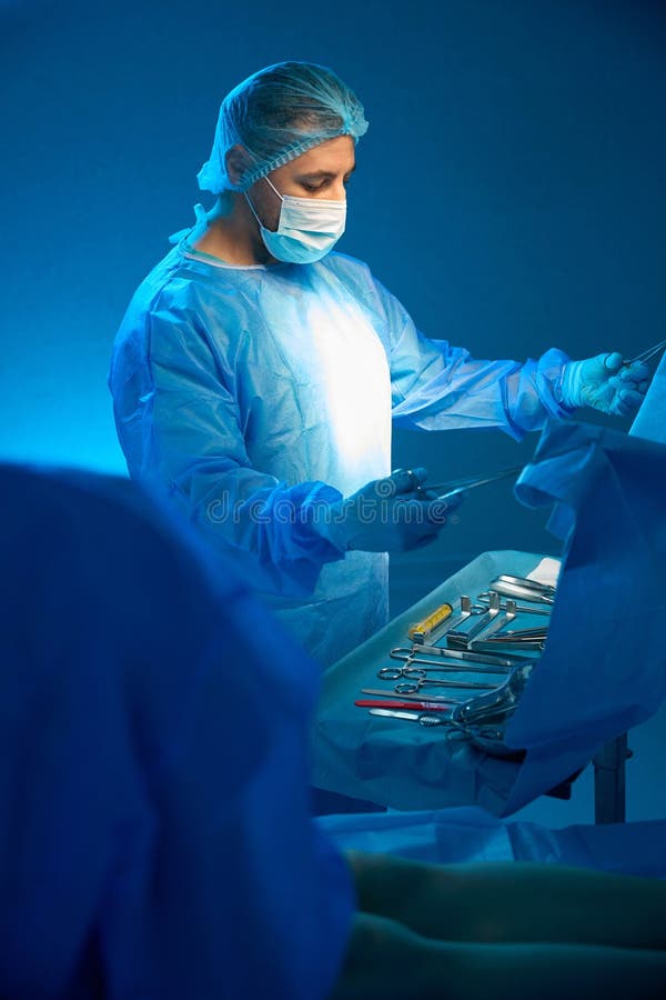 Doctor Surgeon Preparing Sterile Medical Instruments for Operation ...