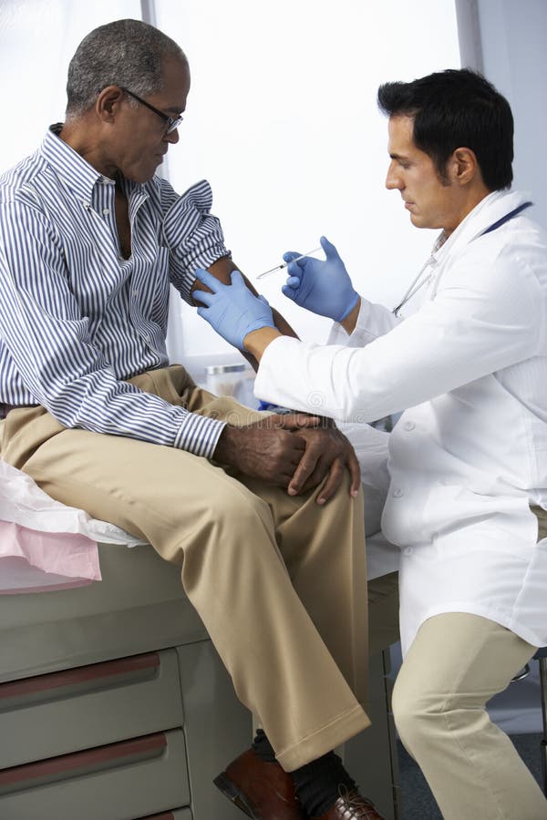 Doctor in Surgery Giving Male Patient Injection Stock Image - Image of ...