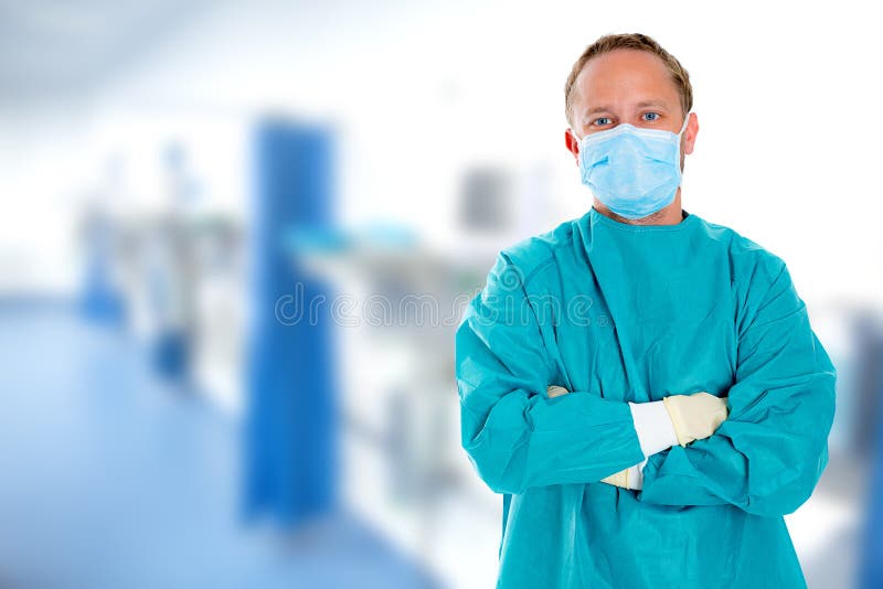 Doctor with Surgical Mask and Green Coat Stock Image - Image of clinic ...