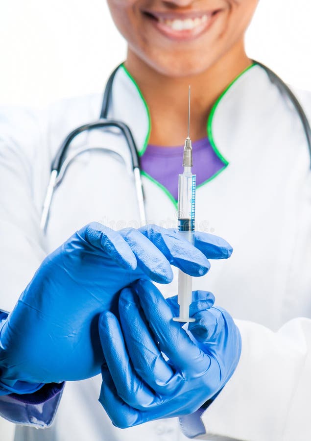 Doctor with syringe stock photo. Image of holding, professional - 34239592