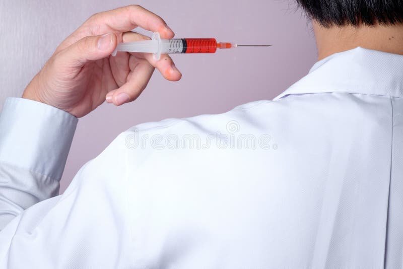 Doctor with syringe stock photo. Image of healthcare - 57786756