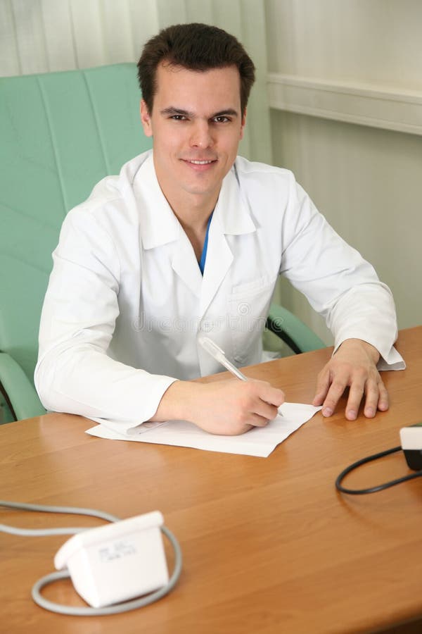 Doctor at the table stock photo. Image of portrait, practitioner - 2229180