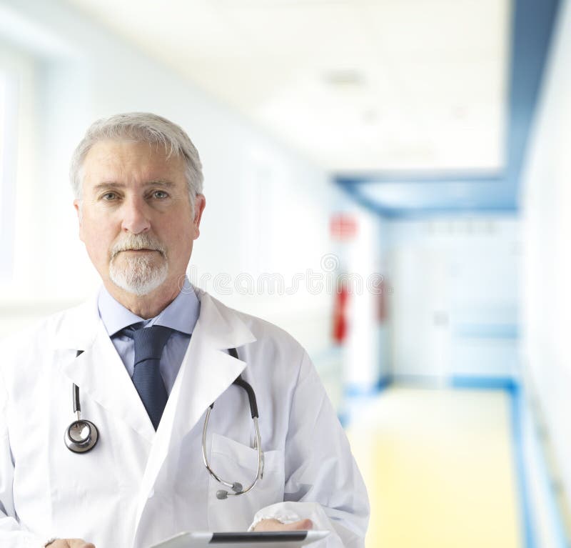 Doctor with tablet stock image. Image of healthcare, senior - 32152533