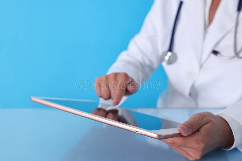 Doctor with Tablet at Table Against Light Blue Background, Closeup View ...