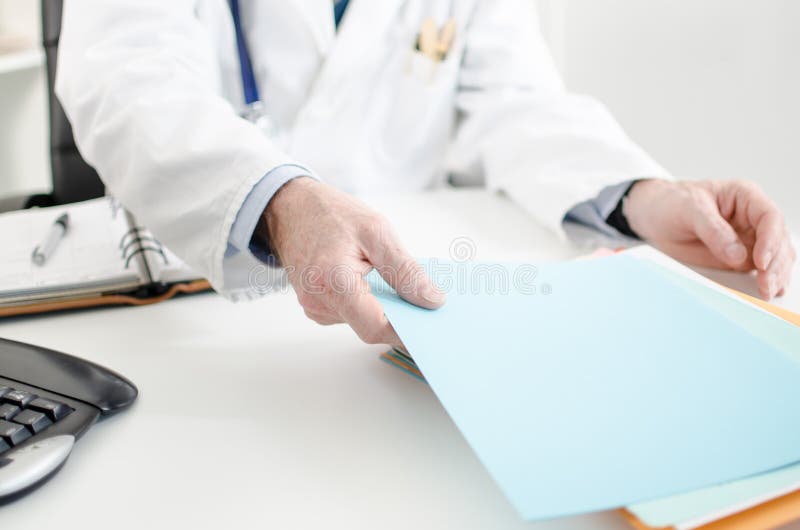 Doctor taking a file stock image. Image of clinical, care - 47213473