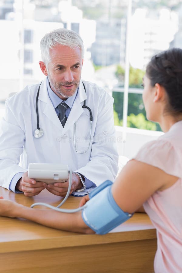 Doctor Taking Heartbeat of a Female Patient Stock Image - Image of ...