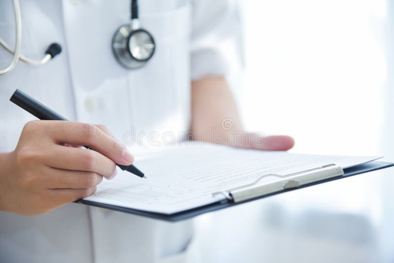 Doctor Taking Note on Checklist Paper. Stock Photo - Image of ...