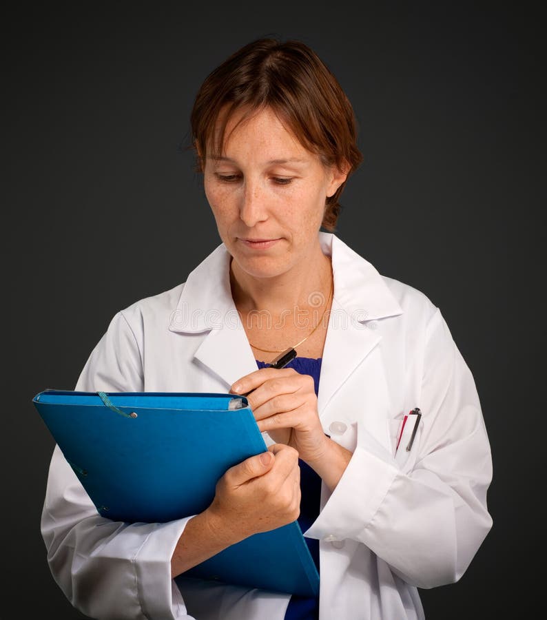 Doctor taking notes stock photo. Image of notes, uniform - 17824306