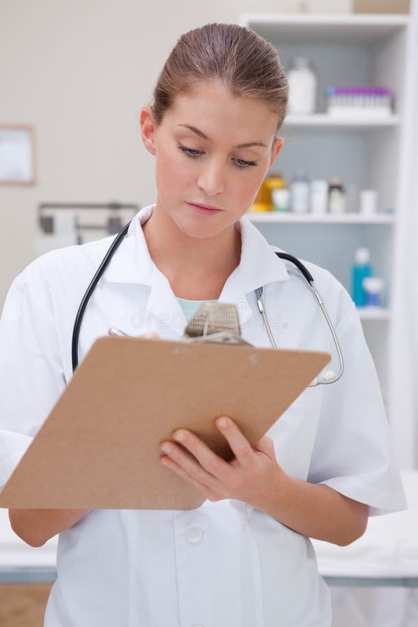 Doctor Taking Notes on Clipboard Stock Photo - Image of illness, person ...