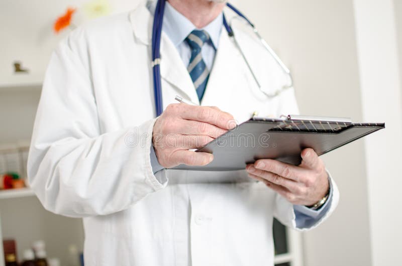Doctor taking notes stock image. Image of healthcare - 47212557