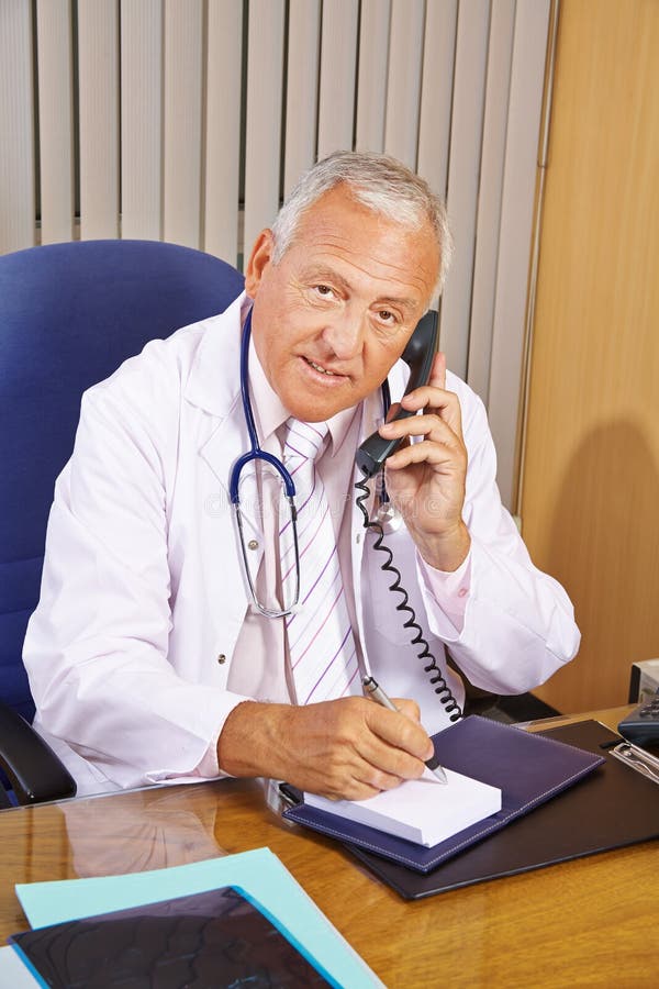 Doctor Taking Notes during Phone Call Stock Image - Image of scheduling ...