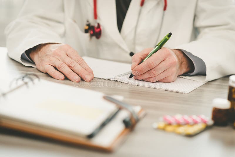 Doctor taking notes stock image. Image of desk, medical - 154677617