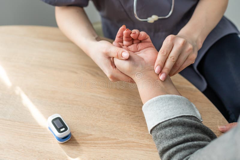 Taking patient s pulse stock image. Image of hospital - 15429351