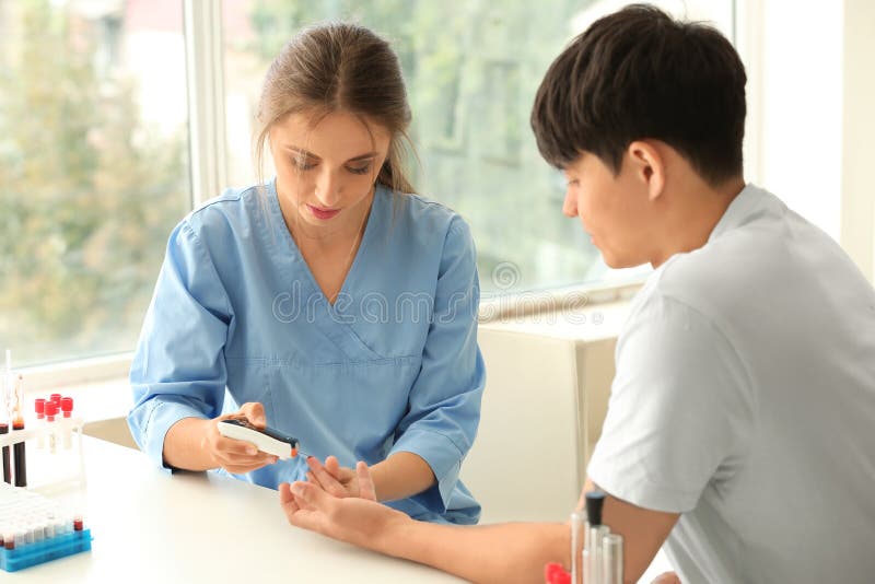 Doctor Taking Sample of Diabetic Patient S Blood Using Digital ...