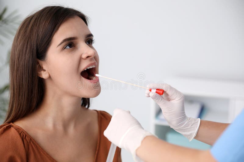 Doctor Taking Sample for DNA Test from Woman in Clinic Stock Photo ...