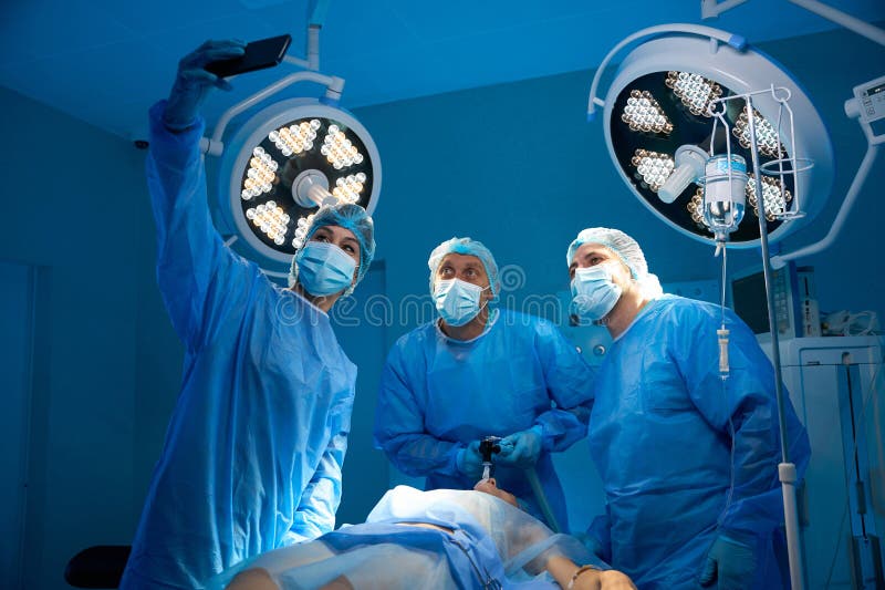 Doctor Taking Selfie on Smartphone with Surgeons after Successful ...